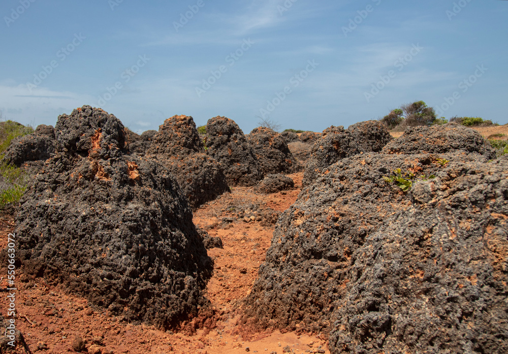 Unique geological formation in a large landscape; mounds found near a ...