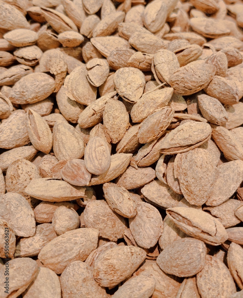 Fondo con detalle y textura de multitud de almendras tostadas con tonos ...