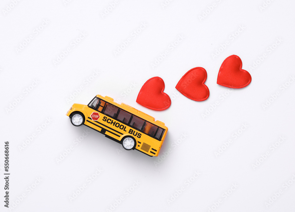 Toy school bus with hearts on a white background. Back to school Stock ...