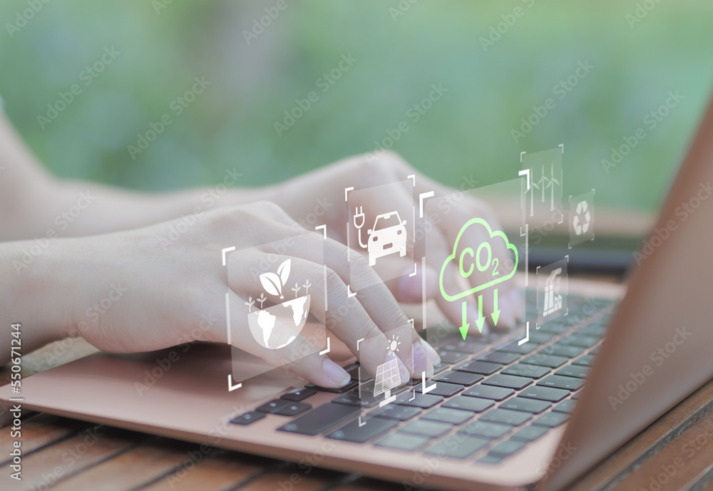 Reduce CO2 emission concept. Woman using laptop for working technology ...