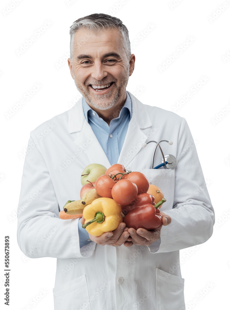 Smiling nutritionist holding fresh vegetables and fruit Stock Photo ...