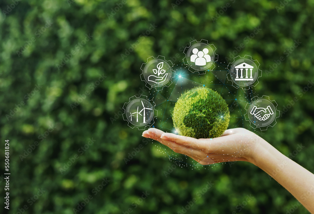 Hand of girl holding green earth for Environmental Social and over the ...
