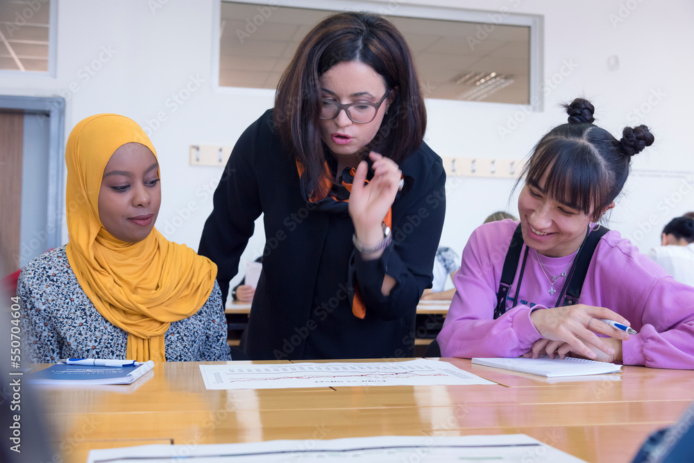 Female teacher or professor giving a lecture in a classroom Stock Photo ...