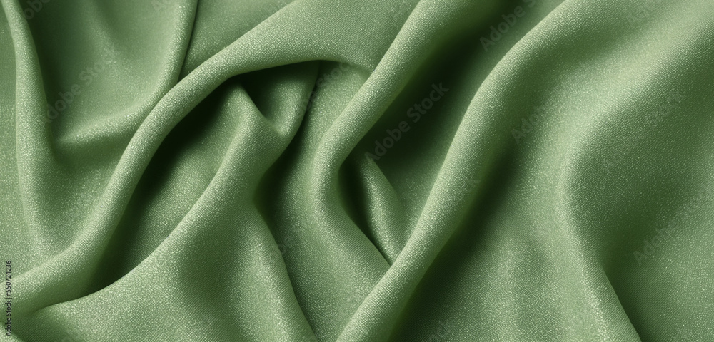 Green satin silk fabric textile with a matte surface, arranged with ...