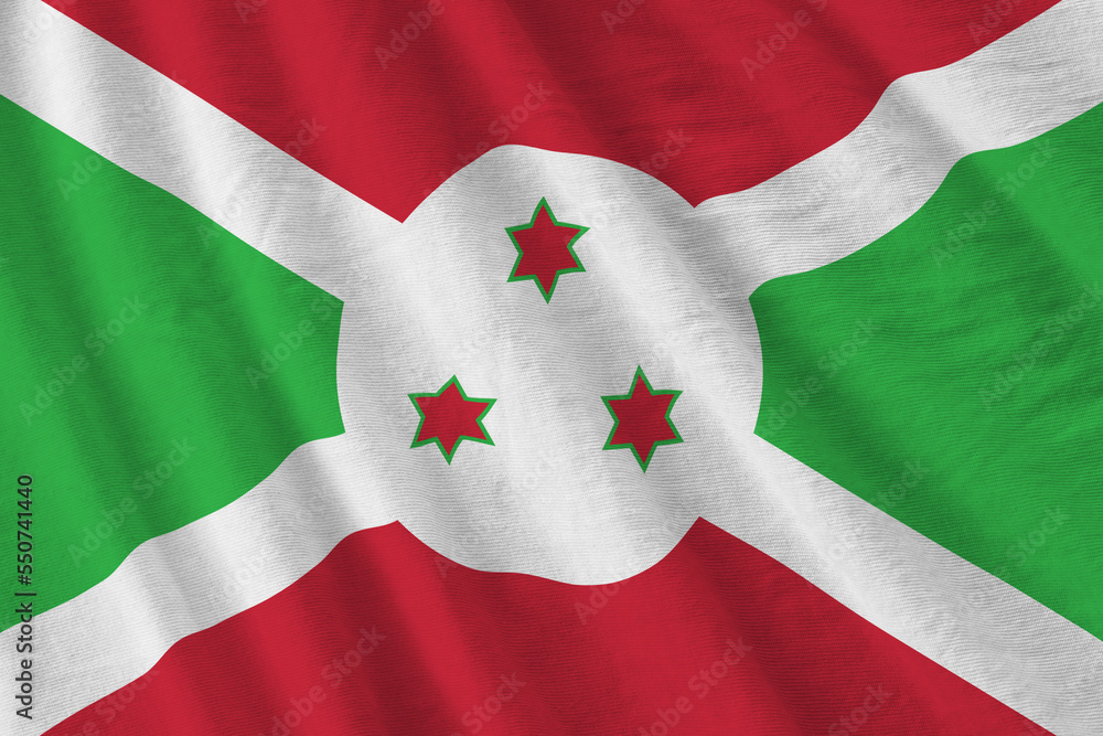Burundi flag with big folds waving close up under the studio light ...