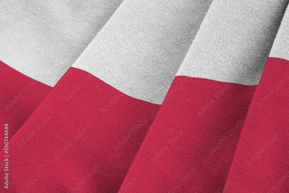 Poland flag with big folds waving close up under the studio light ...
