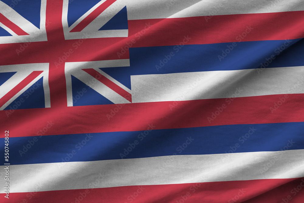 Hawaii US state flag with big folds waving close up under the studio ...