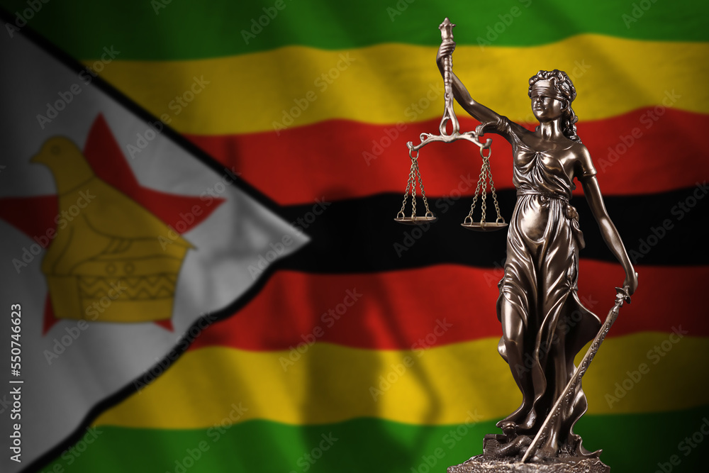 Zimbabwe flag with statue of lady justice and judicial scales in dark ...