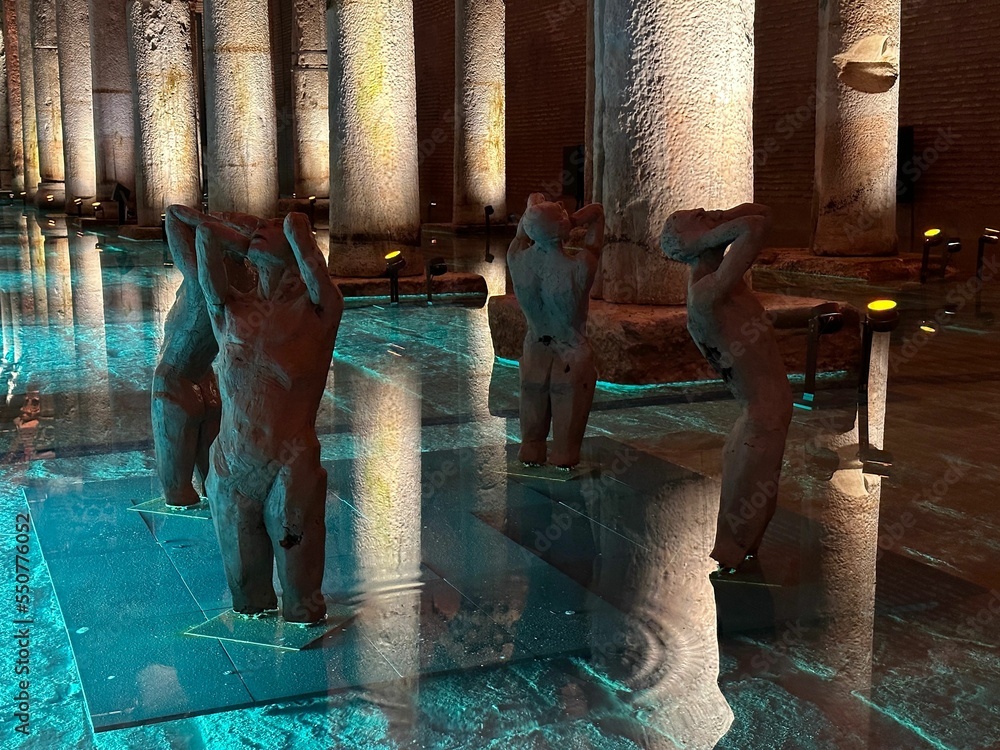 Statues of four men and columns in the water in the restored Basilica ...