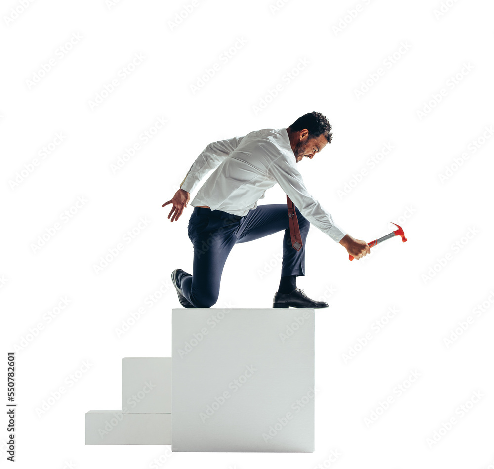 Hardworking businessman smashing a staircase with a sledgehammer on a ...