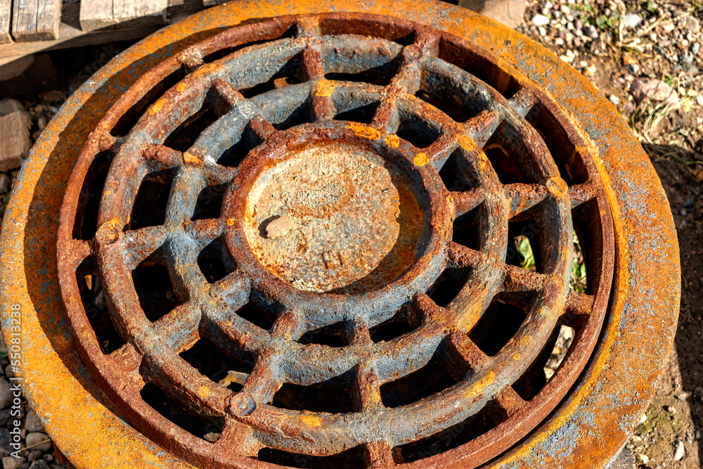 New cast iron manholes prepared for installation at the construction ...