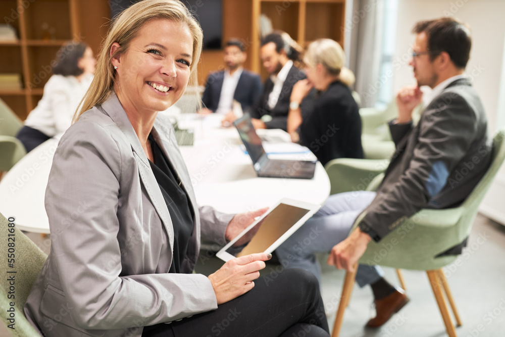 Confident manager using tablet computer in meeting Stock Photo | Adobe ...