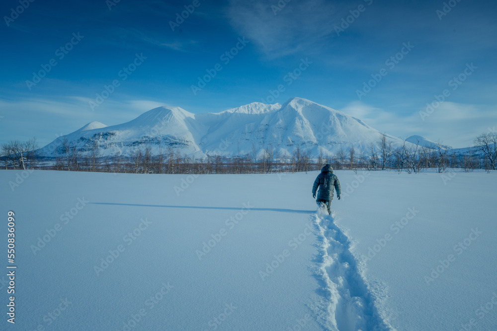 Walking in heavy snow towards beautiful Ahkka, Stora Sjöfallet National ...