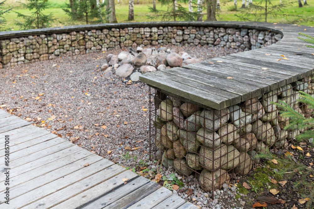 Photo & Art Print Modern garden bench around the fire pit made of ...