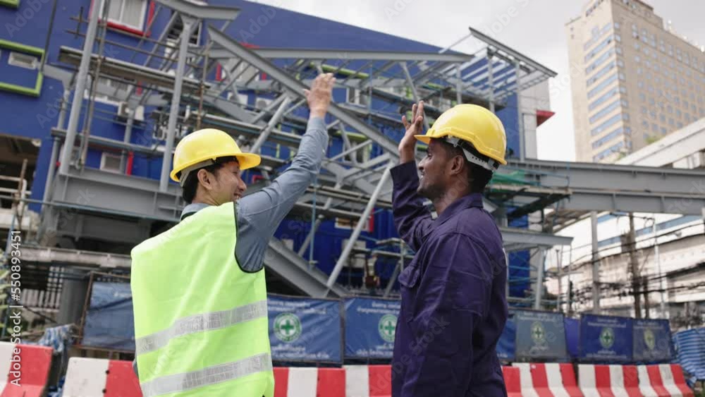 Structural engineers and construction workers are holding blueprints ...