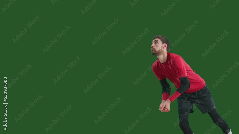 Young man bouncing, falling and batting ball. Athlete playing ...