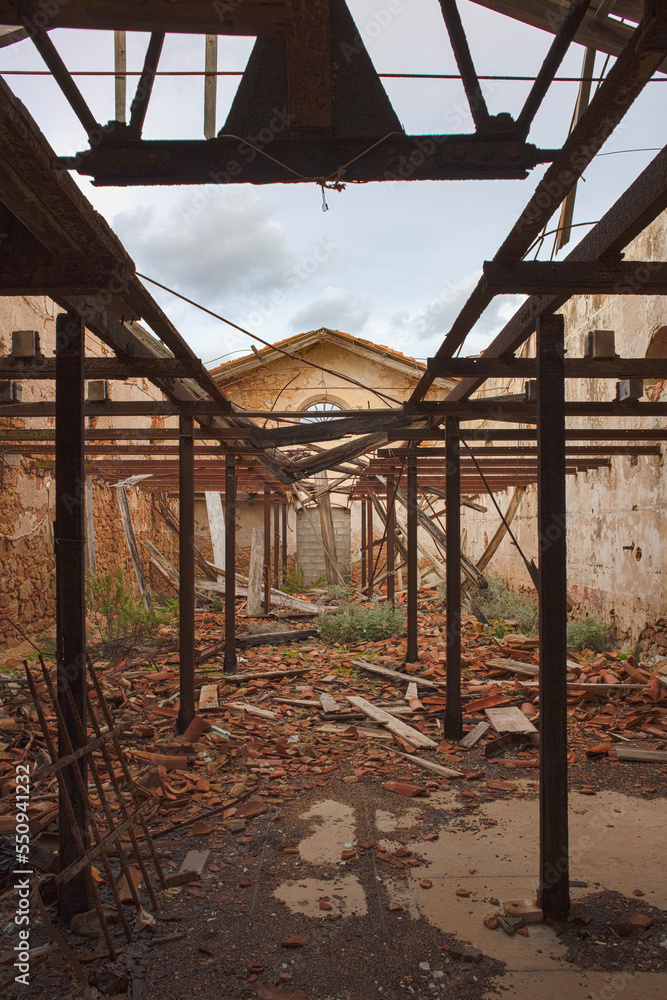 Old abandoned factory building with open run-down wooden roof broken ...