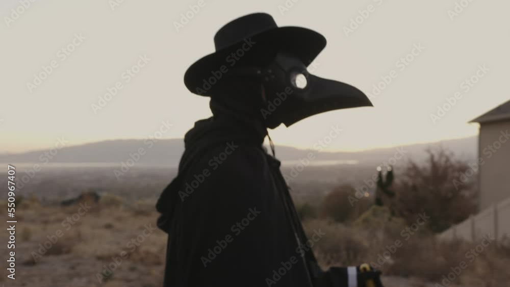Tracking shot of person walking wearing plague doctor costume / Cedar ...