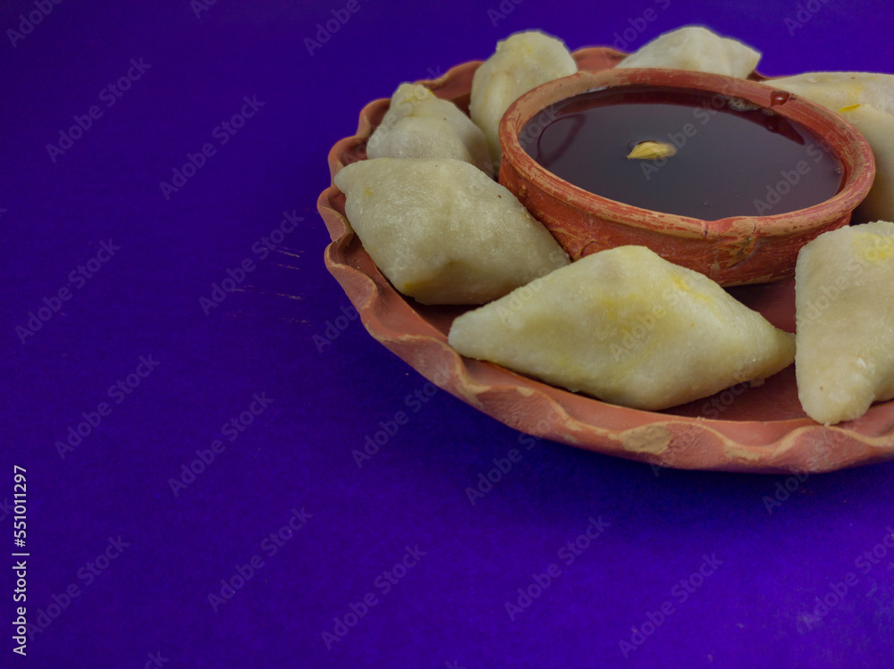 puli pithe or bengali rice flour dumplings with coconut fillings served ...