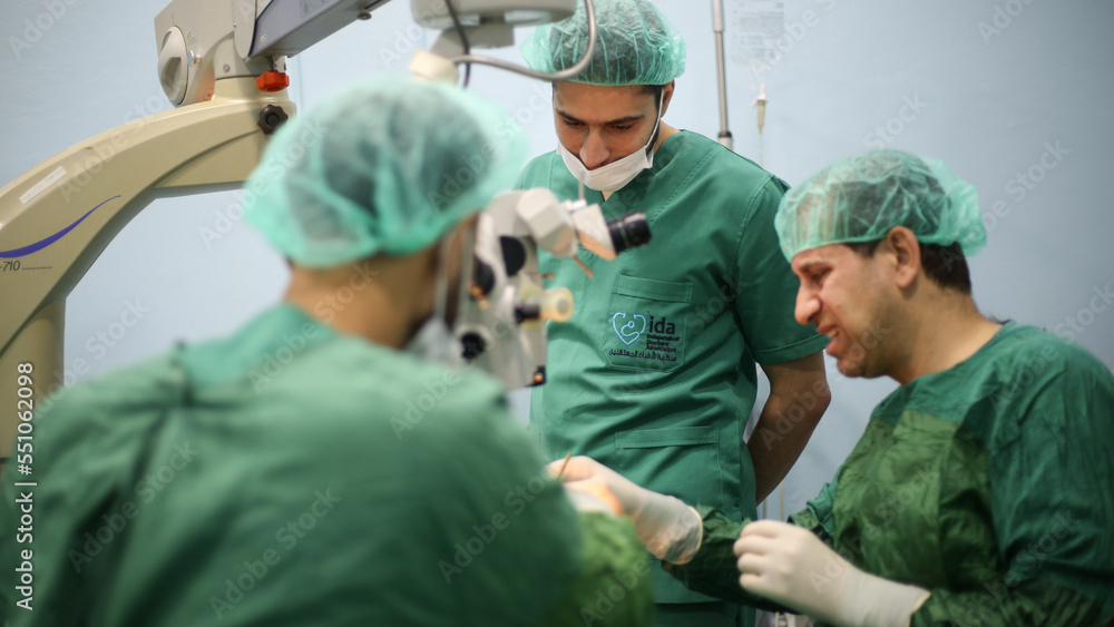 Eye surgery. A patient and surgeon in the operating room during ...