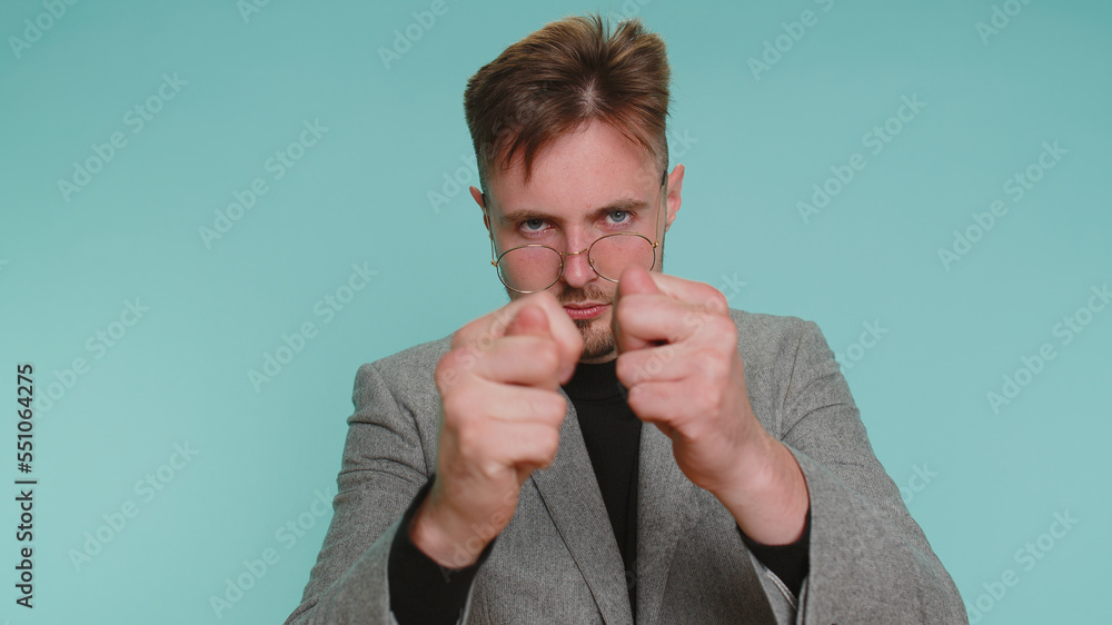 Greedy avaricious young business man showing fig negative gesture, you ...
