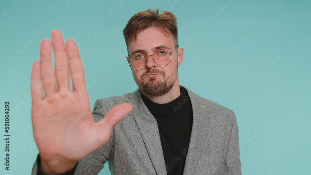 No stop, enought. Business man say No, hold palm folded crossed hands ...