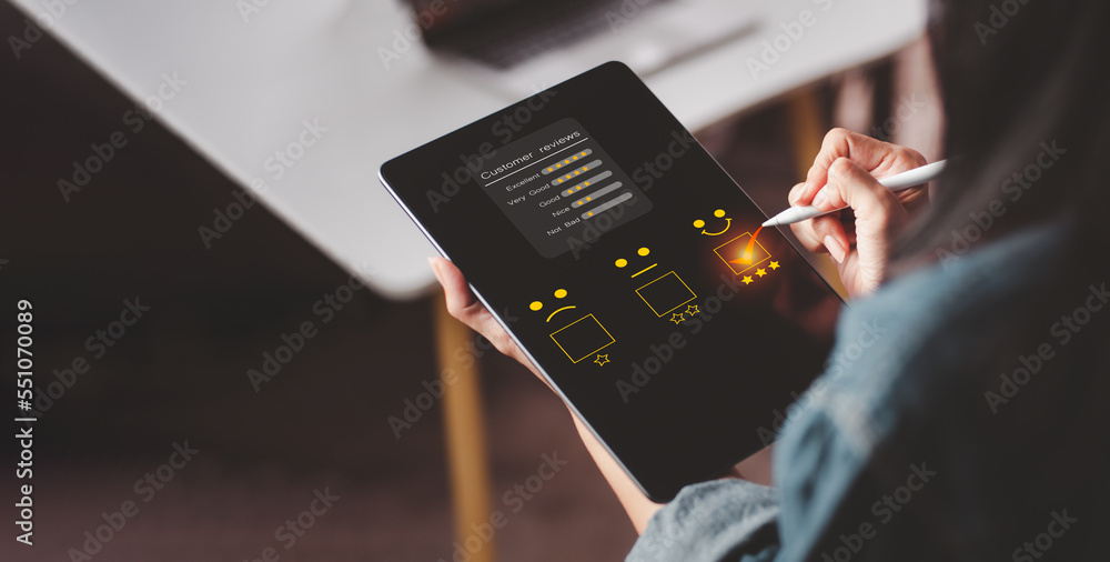 A woman holds a device in close-up.The Tablet Stylus Signature selects ...