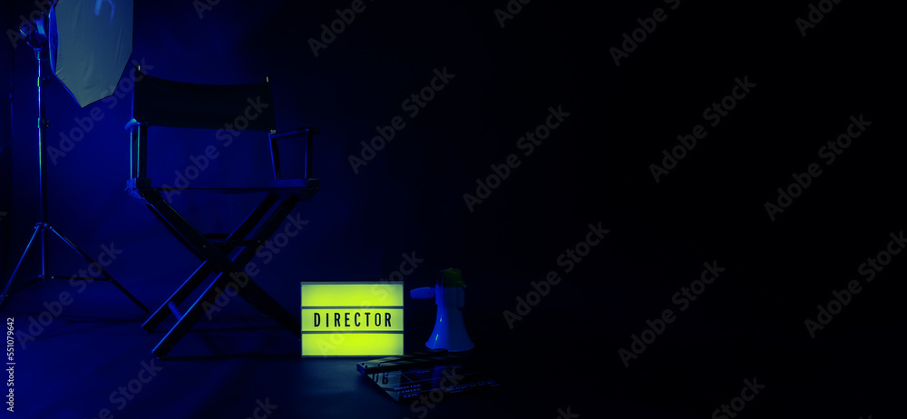 Director chair with cinema lightbox sign Director text on it and ...
