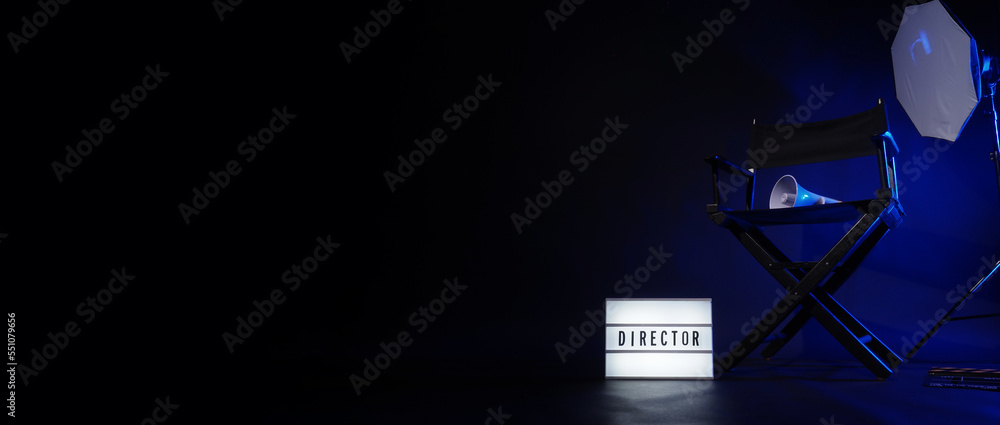 Director chair with cinema lightbox sign Director text on it and ...