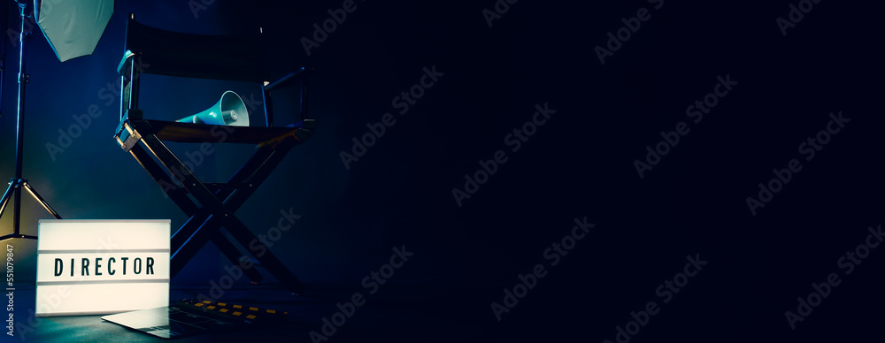 Director chair with cinema lightbox sign Director text on it and ...
