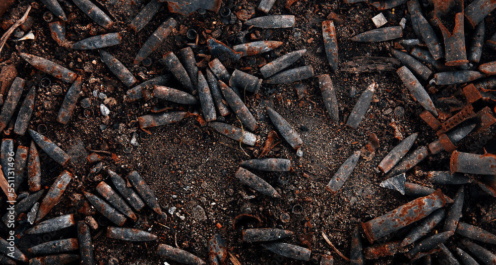 Burnt ammunition, bullets and casings after the fire. Burned arsenal of ...