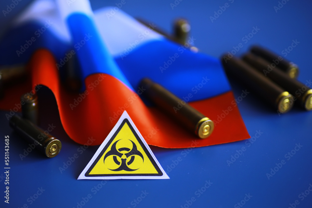 Russian flag and bullet casings on the table. Background concept ...