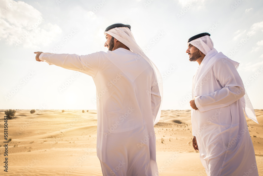 Arab men wearing typical middle eastern clothing in the desert Stock ...