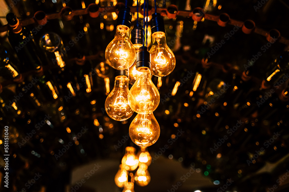 light bulbs in a dark corridor from glass bottles. the dim light of ...