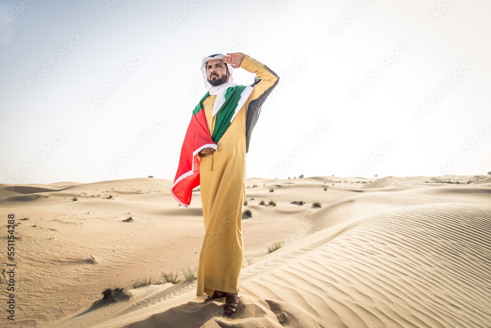 Portrait of handsome middle-eastern man wearing traditional emirates ...