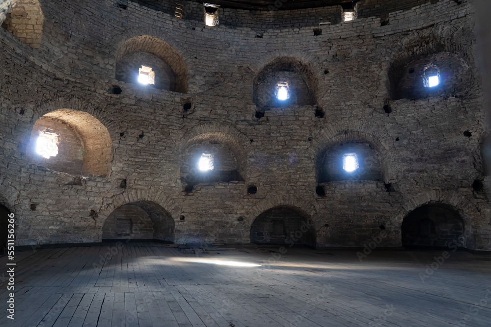 The inner wall of a large ancient fortress tower. Several tiers of ...