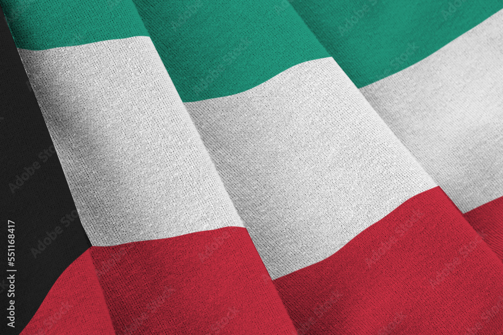 Kuwait flag with big folds waving close up under the studio light ...