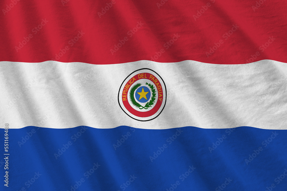 Paraguay flag with big folds waving close up under the studio light ...