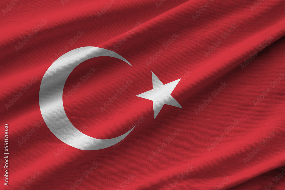 Turkey flag with big folds waving close up under the studio light ...