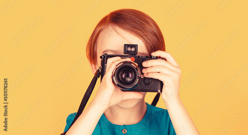 Child in studio with professional camera. Boy using a cameras. Baby boy ...