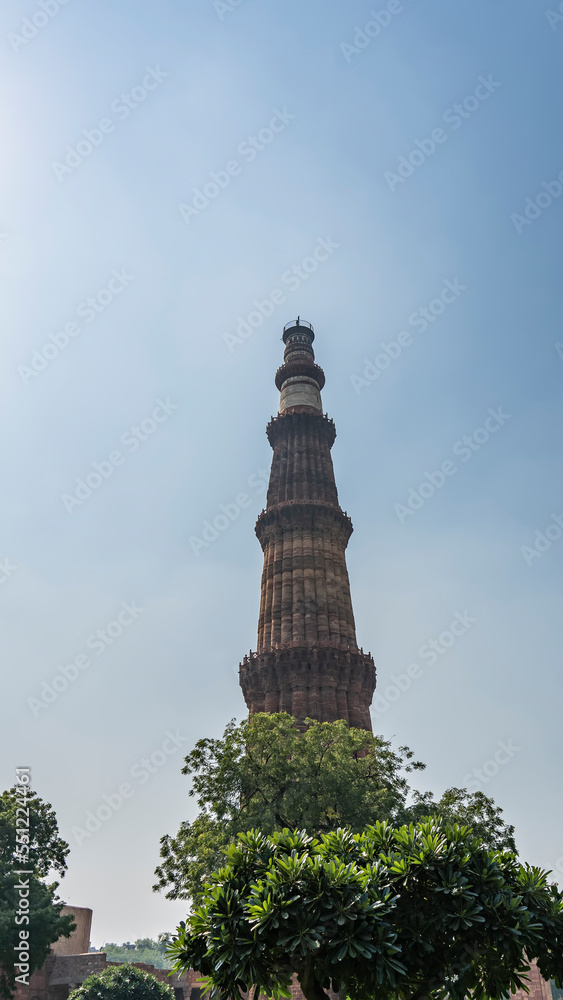 The world's tallest brick minaret Qutub Minar against the blue sky ...