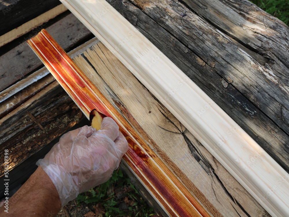 impregnation of light wood fillets with a dark stain solution to reveal ...