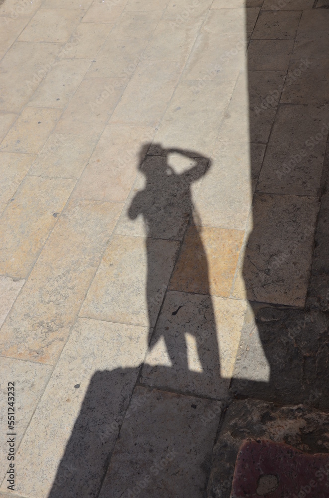 Shadow of a girl in the ancient ruins of Greek and Roman buildings in ...