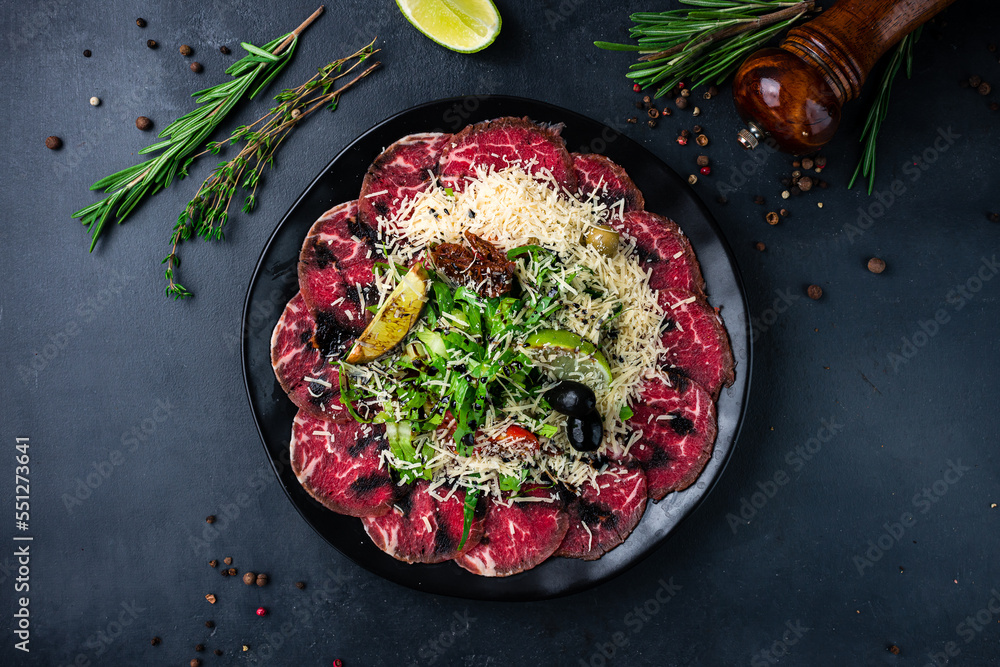 Italian food beef carpaccio: beef tenderloin, romaine lettuce, sun ...