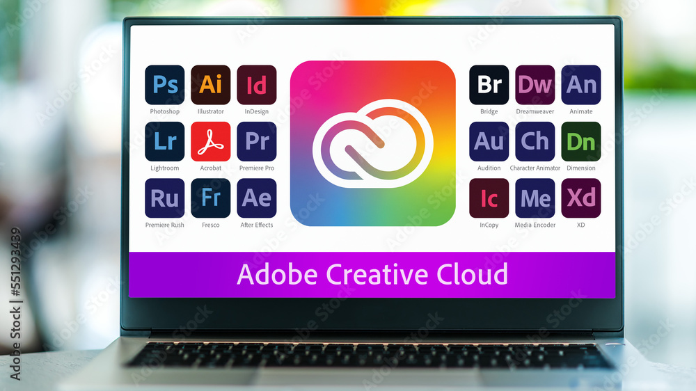 Laptop computer displaying logotypes of Adobe Creative Cloud Stock ...