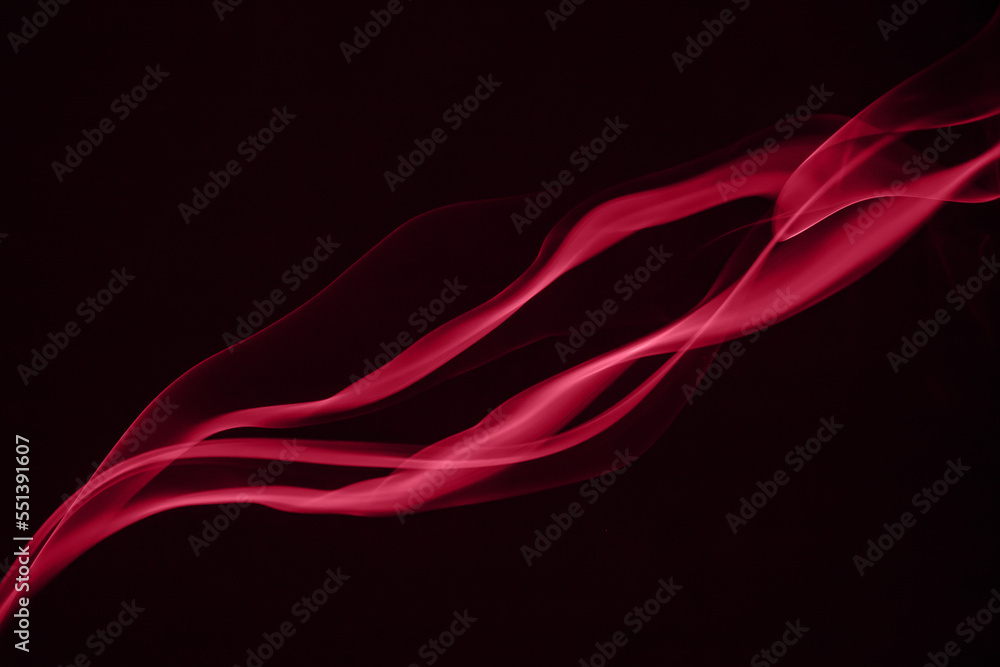 Red puffs of smoke on black background. Color of the year 2023 - Viva ...