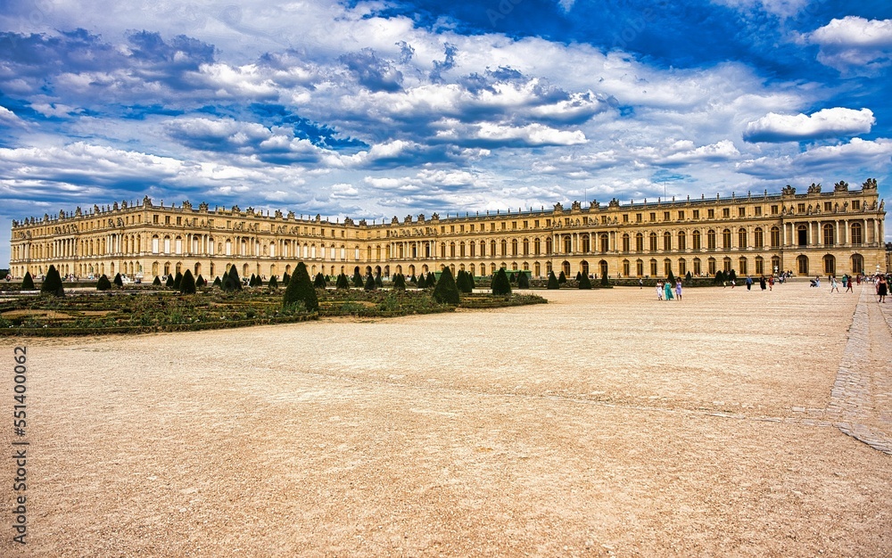 Low-angle of Palace of Versailles royal residence building cloudy ...