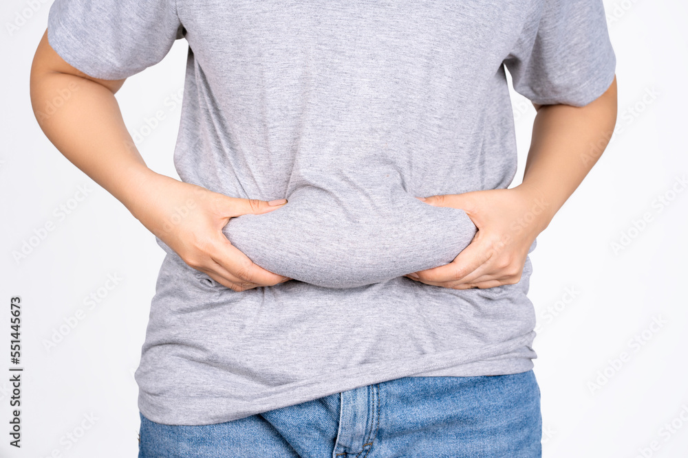 Asian fat women has overweight in jeans. woman's hand holding excessive ...