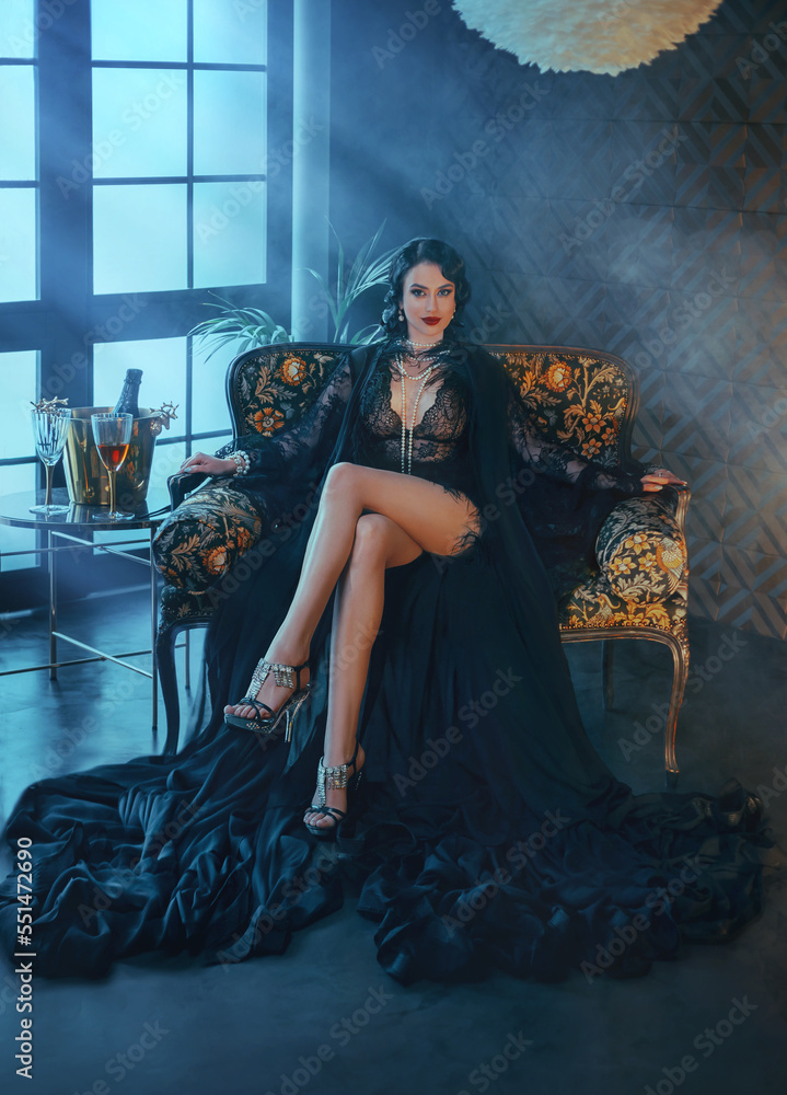 1920s retro style flapper lady. Fantasy sexy woman queen vampire sitting on throne vintage sofa ...