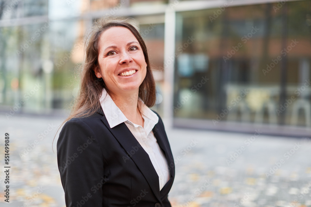 Happy smiling businesswoman walking outdoors in city streets Stock ...